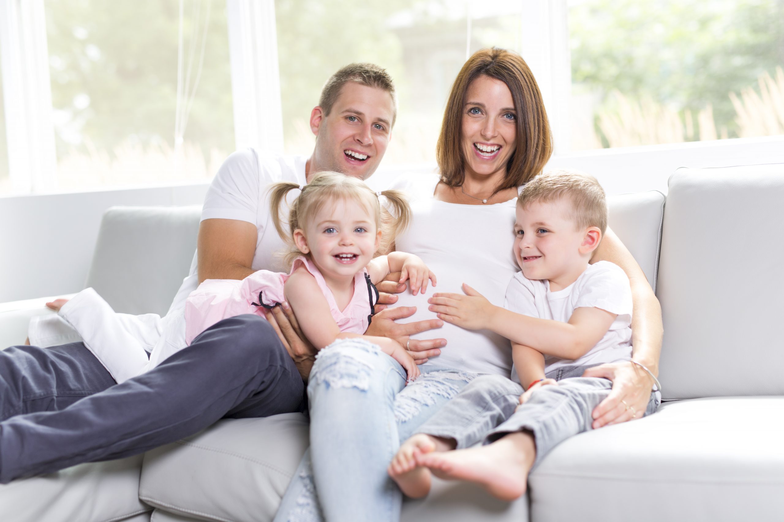 Beautiful family portrait sitting in the living room at home | Ruah ...